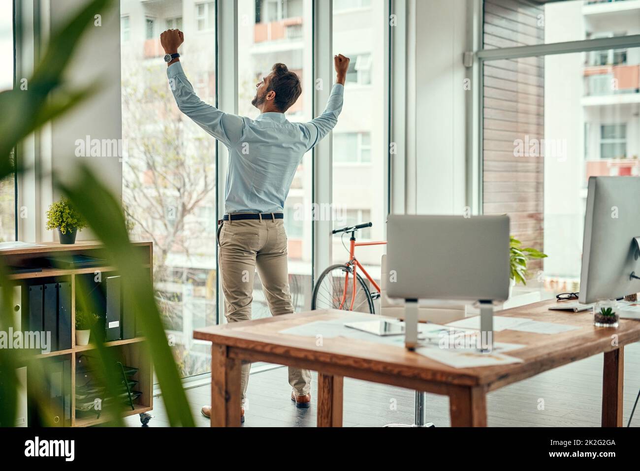 Businessman standing window hi-res stock photography and images - Alamy