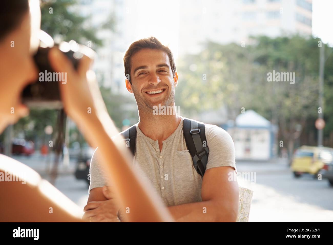 Thats one for the postcard. a young man posing for a photo while ...
