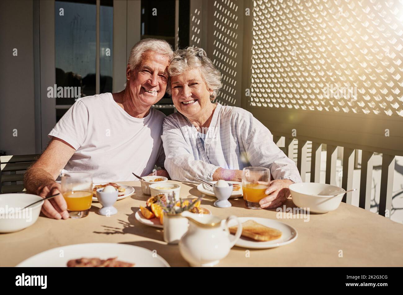 We still start our mornings together. Shot of a happy senior couple ...