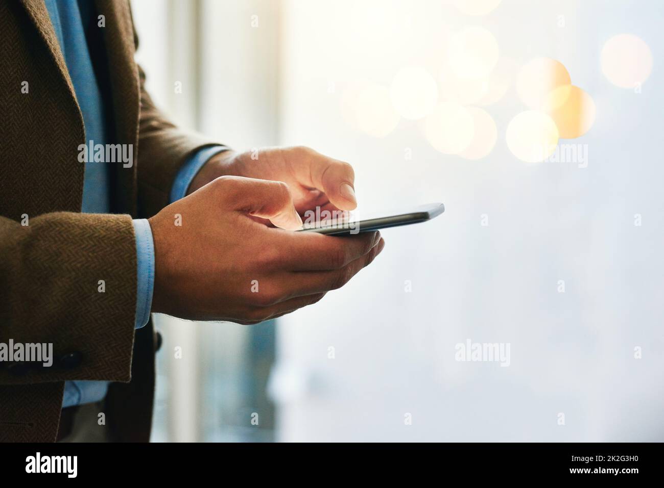 Taking his work mobile. Cropped shot of an unrecognizable businessman ...