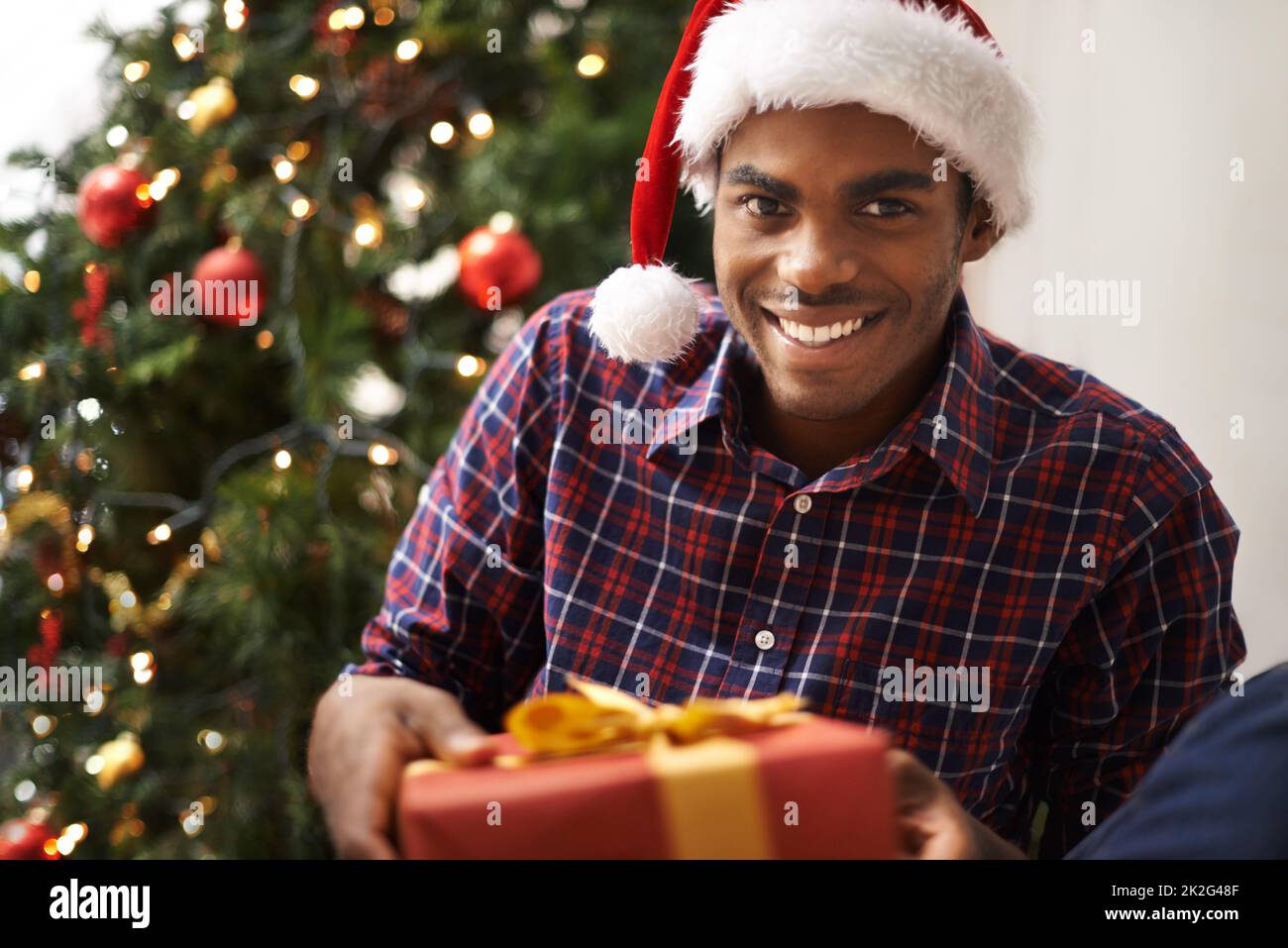 Christmas is my favourite time of year. Portrait of a handsome young ...