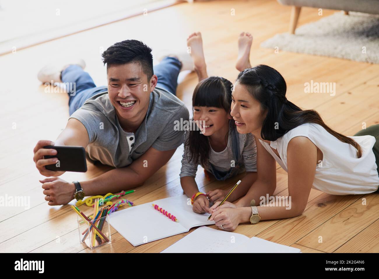 Pre homework selfie. Shot of a cheerful mother and father doing ...