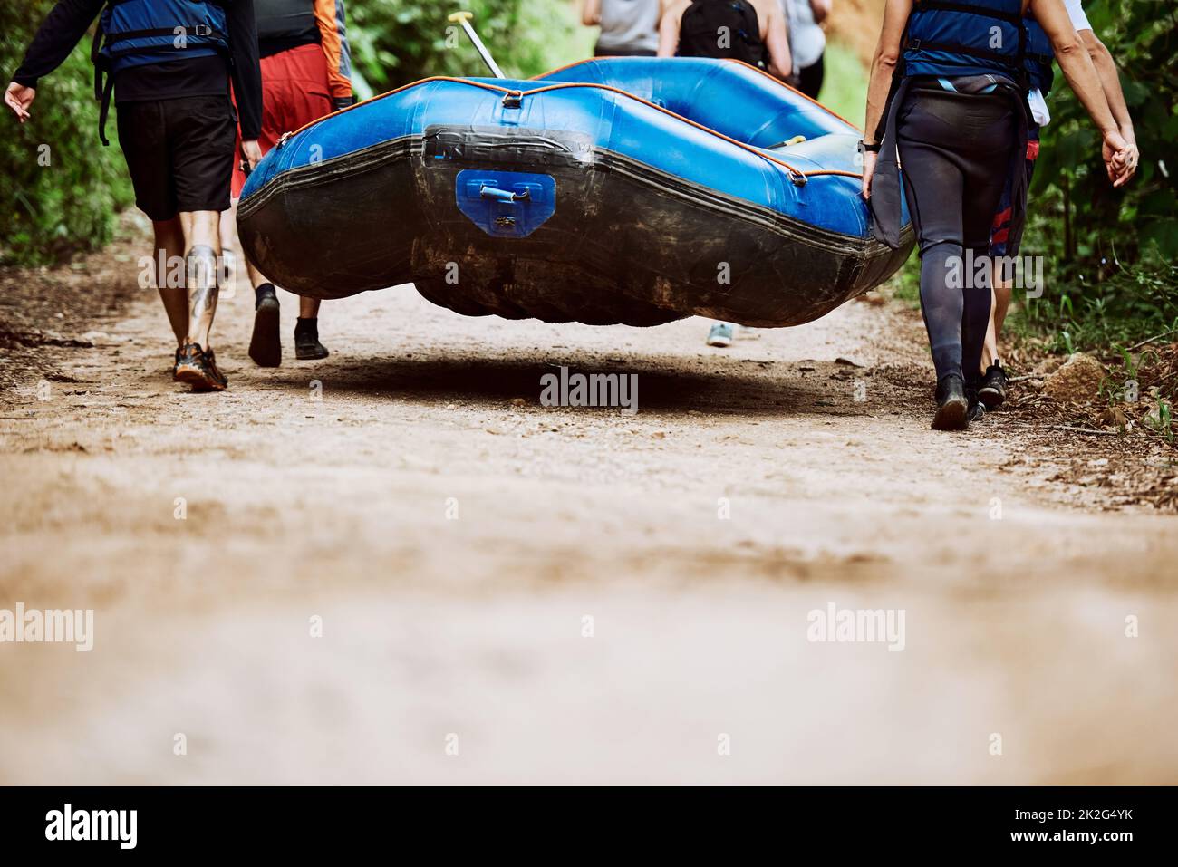 Almost there guys. Low angle shot of a group of unrecognizable people ...
