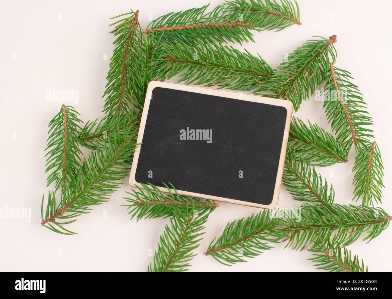Christmas holiday background, chalkboard with fir branches, winter ...
