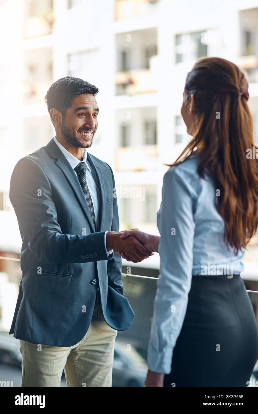Female boss shaking hands employee hi-res stock photography and images ...