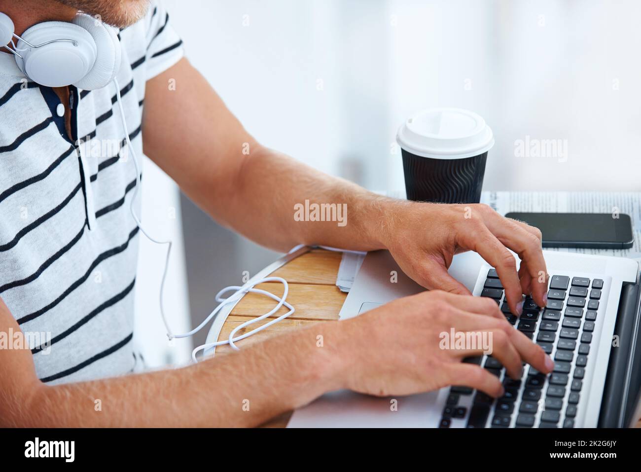 The moneymakers at work. Closeup of a man typing on a laptop keyboard ...
