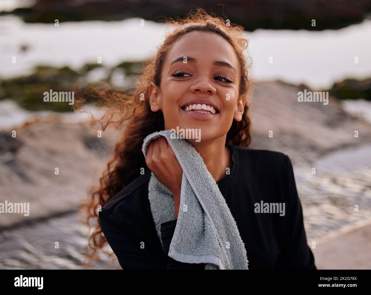 Yoga works up a sweat. Shot of an attractive young woman standing alone ...