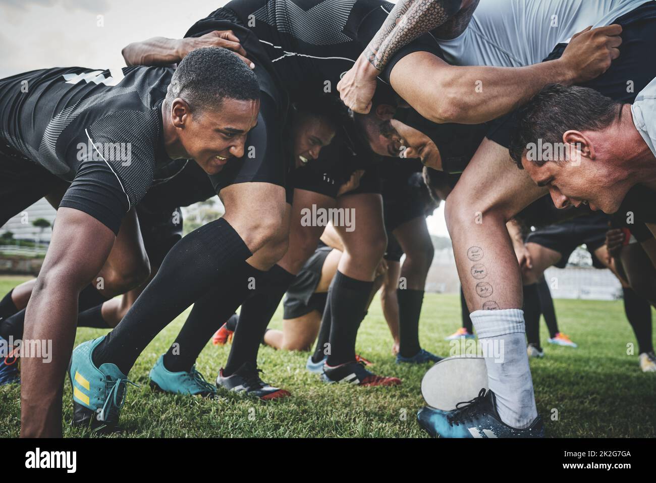 Its a face off. Low angle shot of two young rugby teams competing in a ...