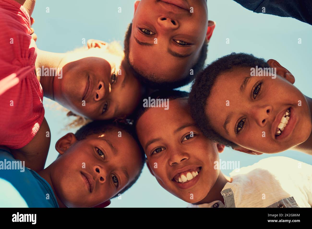 Group children arm in arm hi-res stock photography and images - Alamy