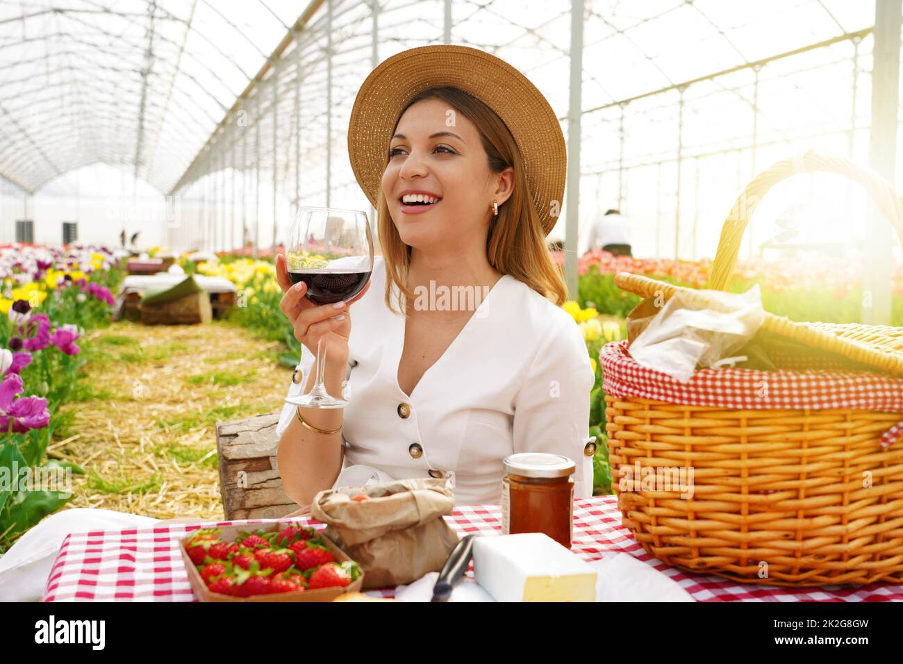 Picnic inside flowers greenhouse with zero kilometer products. Cheerful ...
