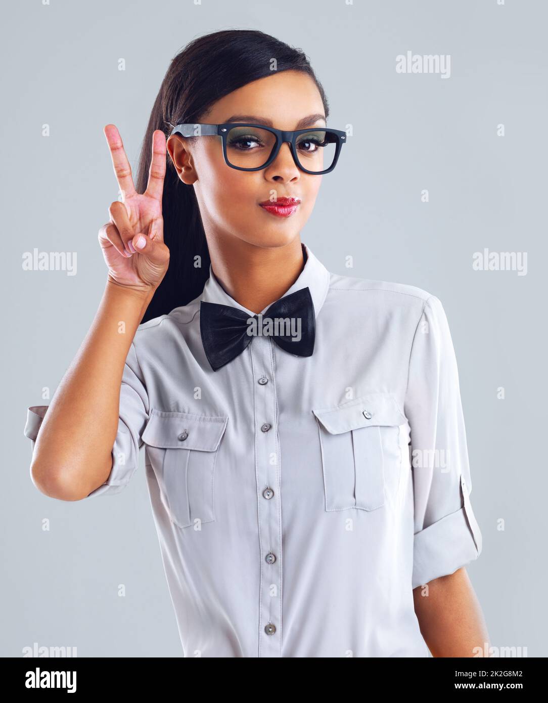 Peace out yo. Cropped portrait of a trendy young woman showing a peace ...