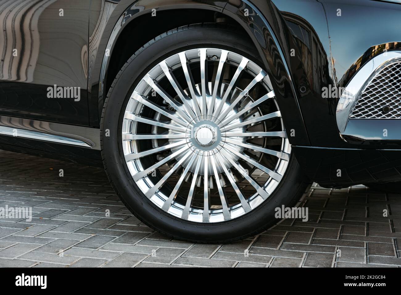 Aluminium rim of luxury black suv car wheel close up Stock Photo - Alamy