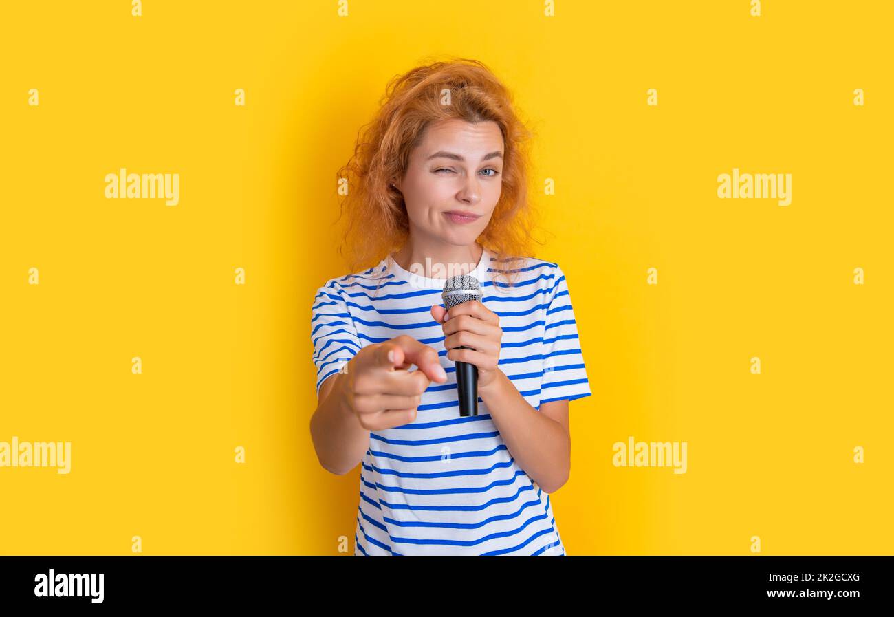music concept. woman singer isolated on yellow background. woman singer ...