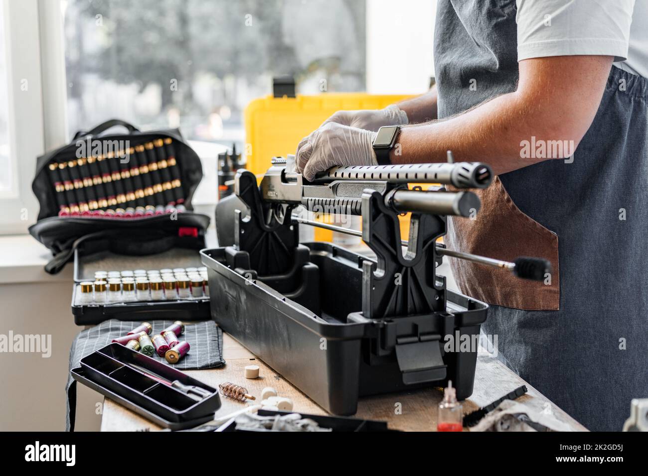 The gunsmith maintaining his rifle in a workshop Stock Photo - Alamy