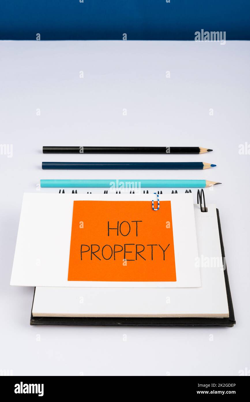 Sign displaying Hot Property. Word Written on Something which is sought ...