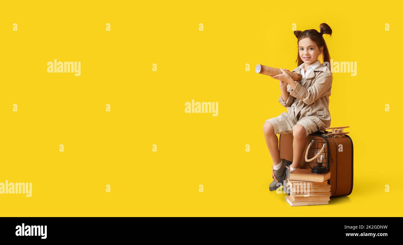 Cute little adventurer on yellow background with space for text Stock ...