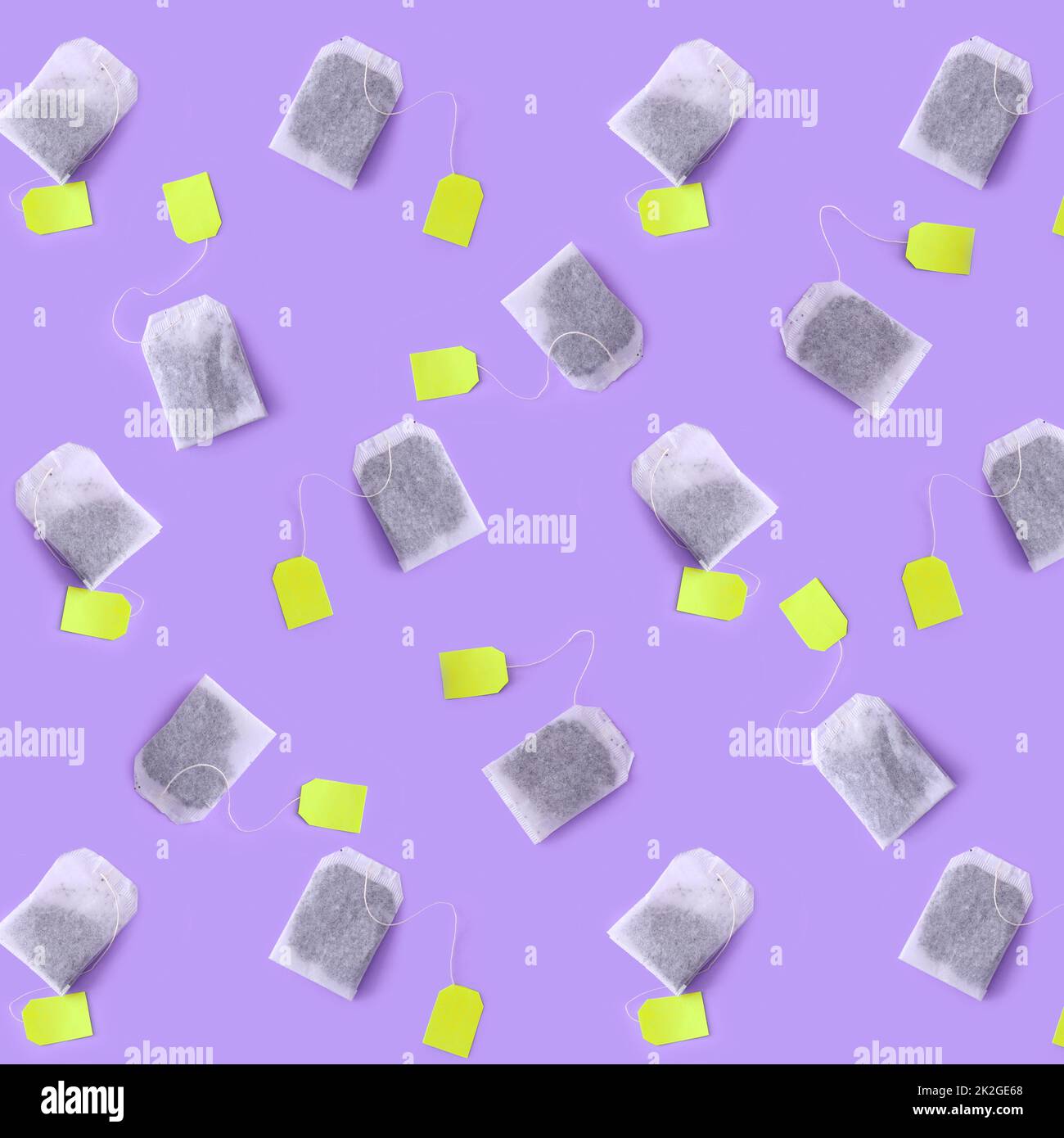 Many tea bags on lilac background. Pattern for design Stock Photo - Alamy