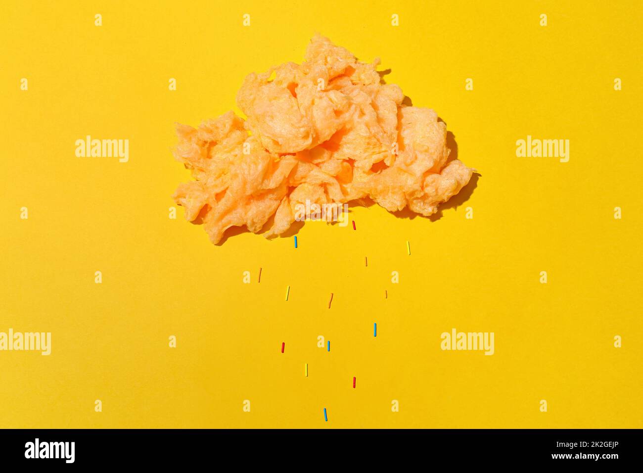 Tasty cotton candy cloud in shape of cloud with sprinkles on color ...