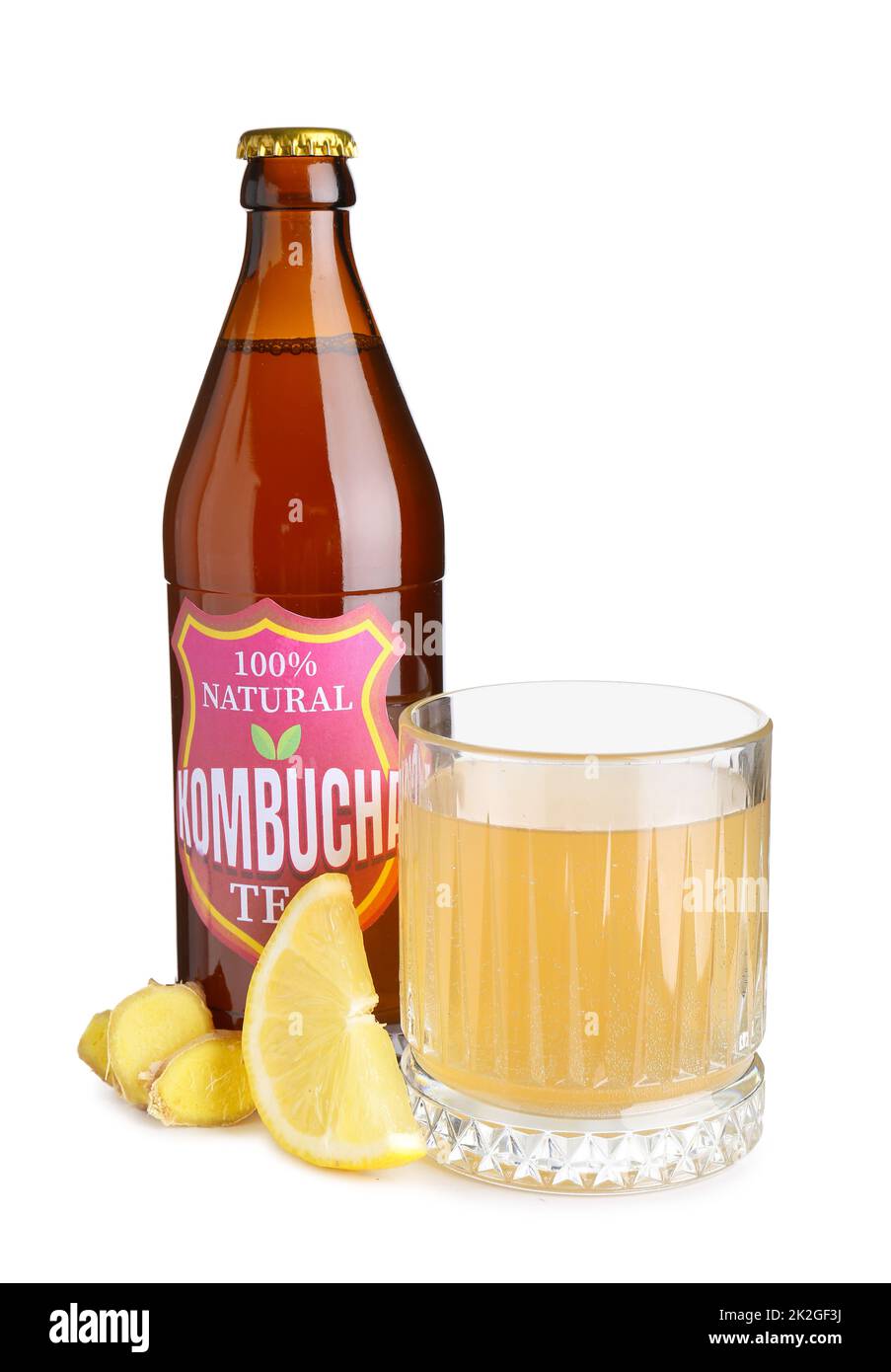 Bottle and glass of delicious kombucha tea on white background Stock ...