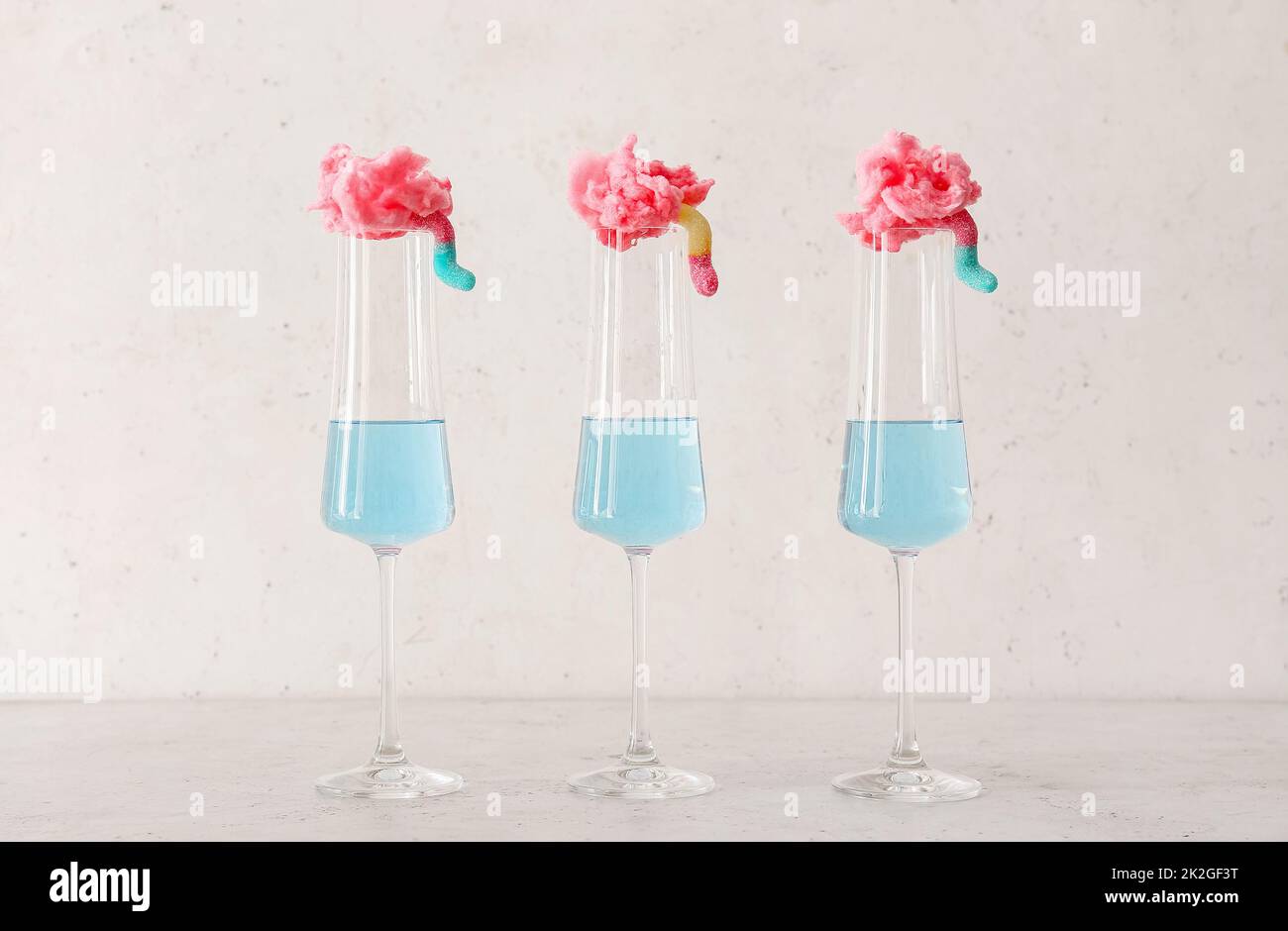 Glasses with delicious cotton candy cocktail on light background Stock ...