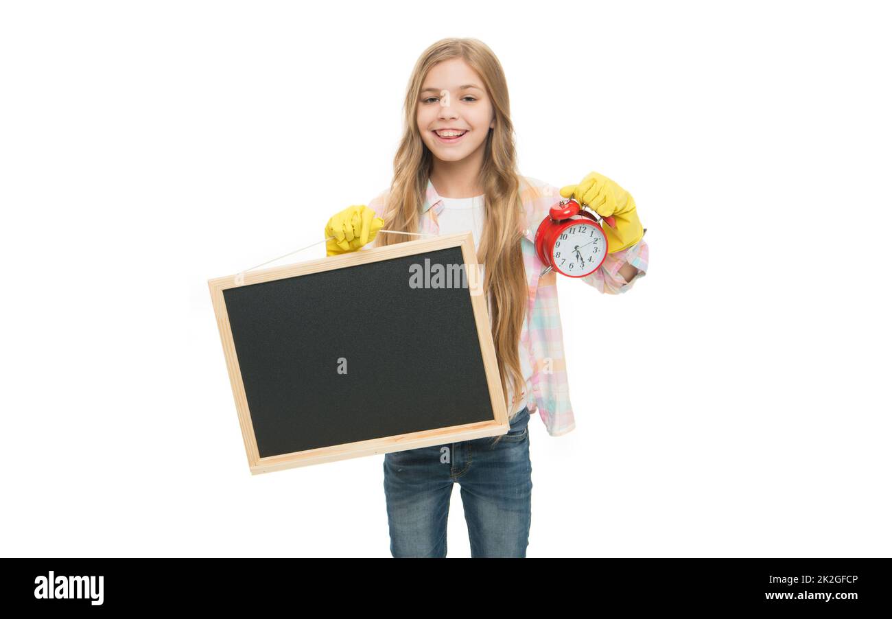 Happy teen girl housecleaner holding chalkboard and clock in rubber ...