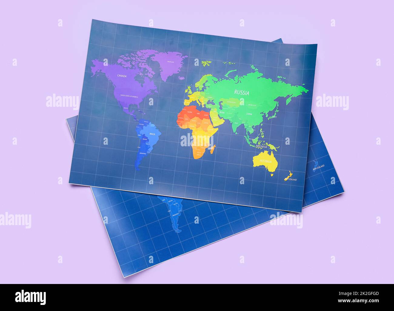 World maps on lilac background Stock Photo - Alamy