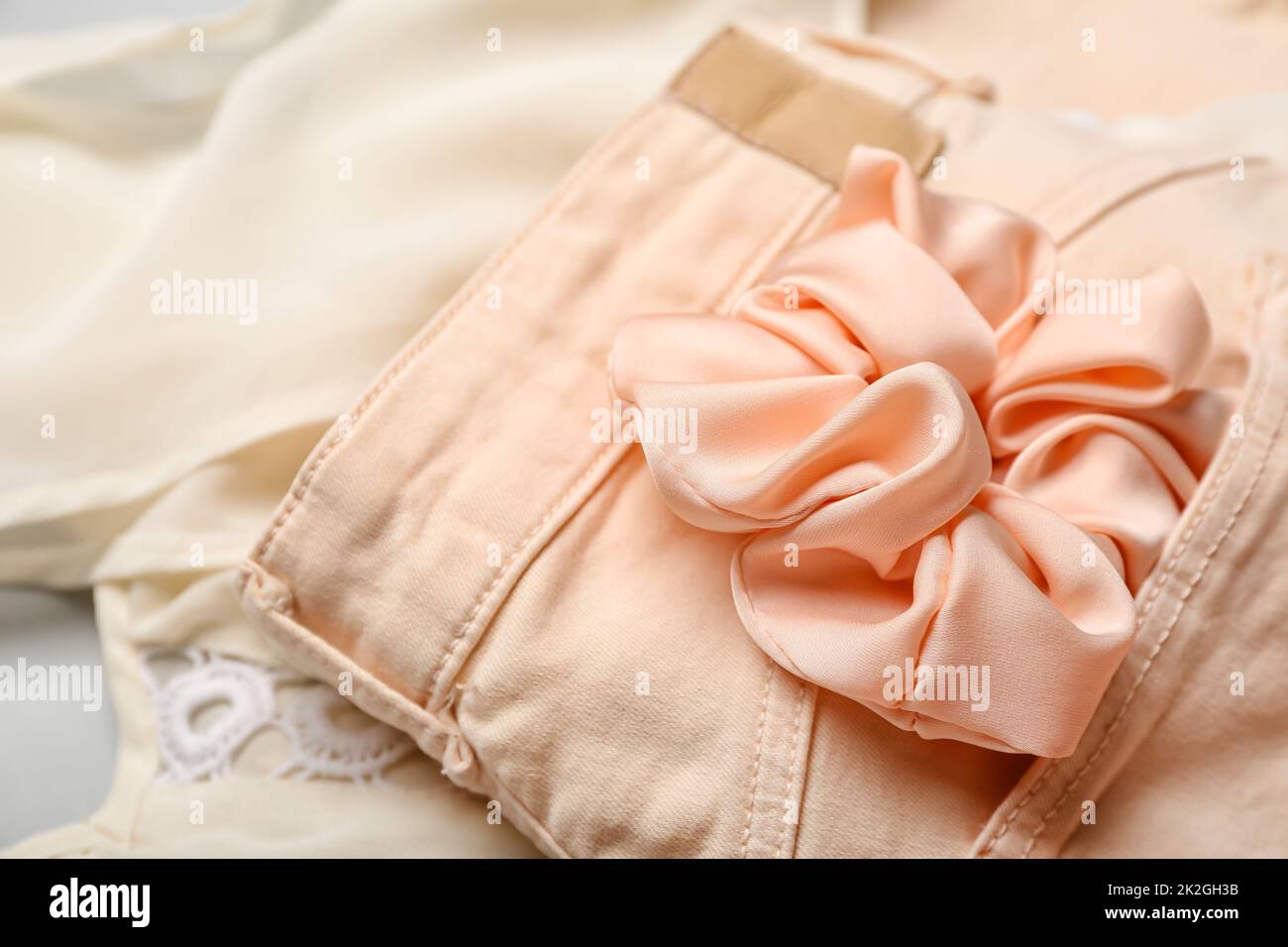 Female clothes and silk scrunchy, closeup Stock Photo - Alamy
