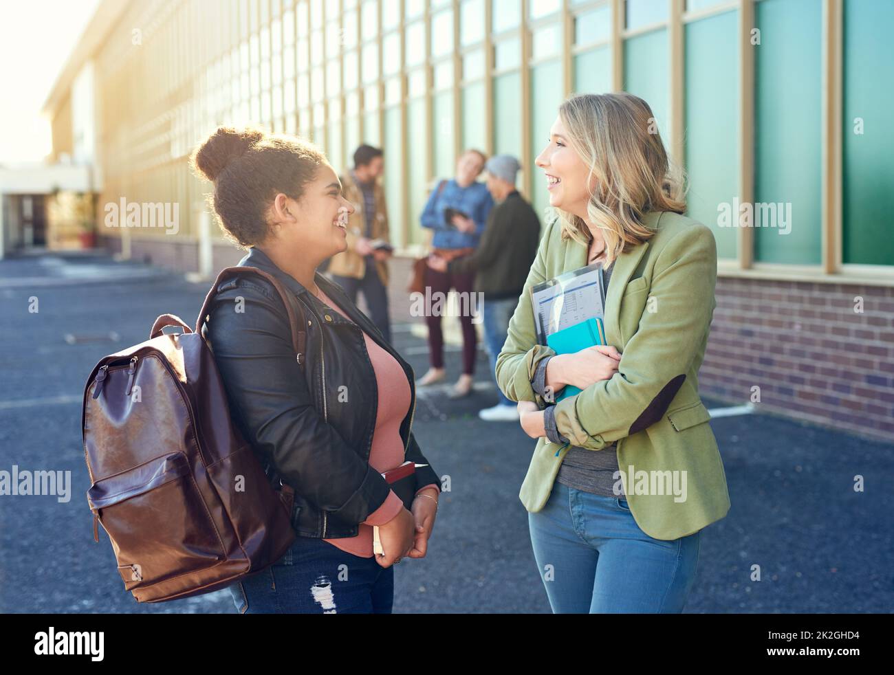 Quick talks before we head to class. Shot of college students between ...