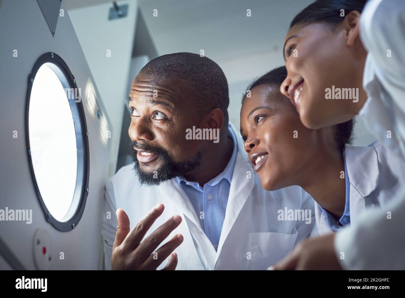 Notice anything new. Show of a group of scientists working in a lab ...