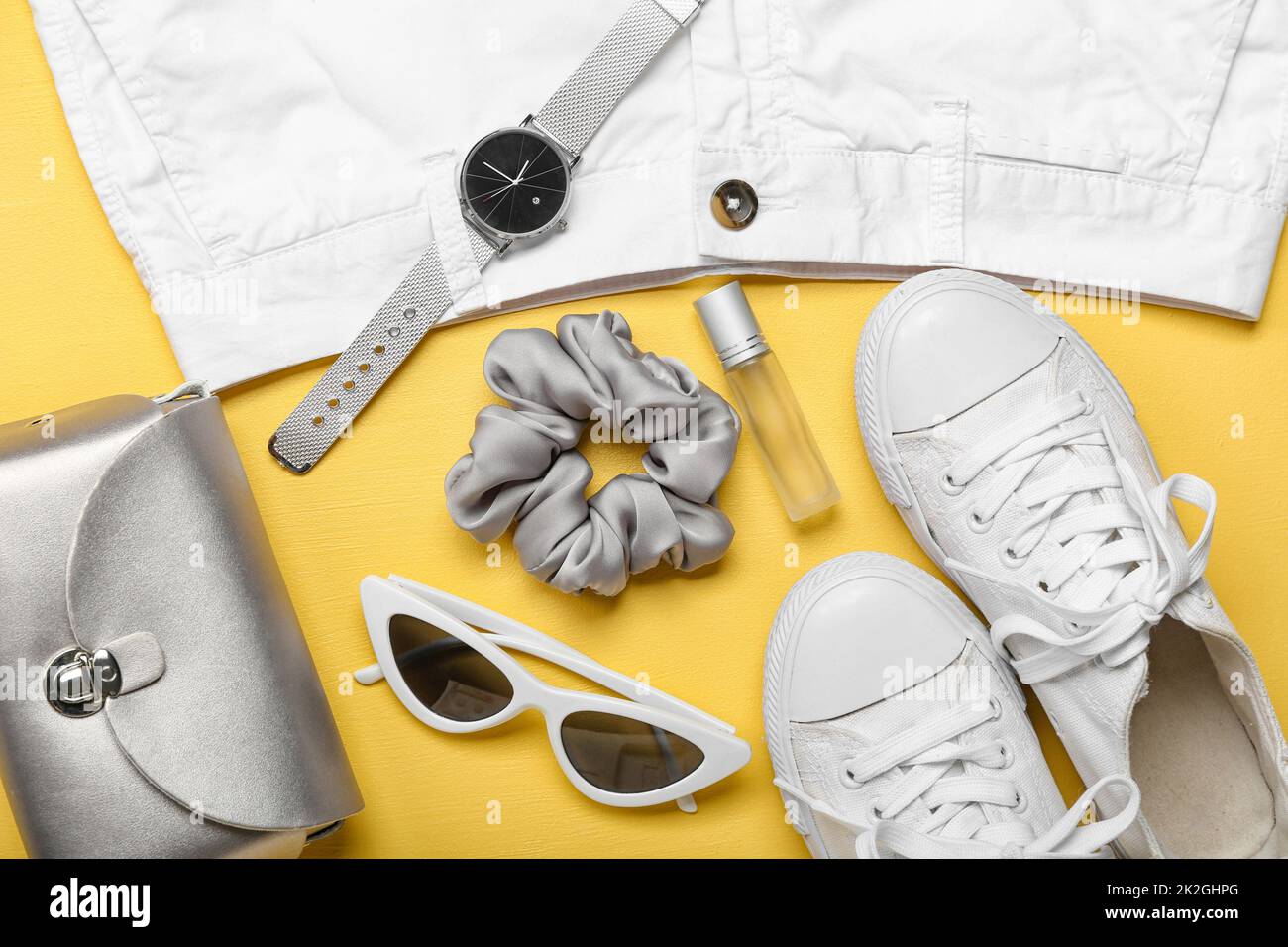 Stylish female clothes, silk scrunchy and different accessories on ...