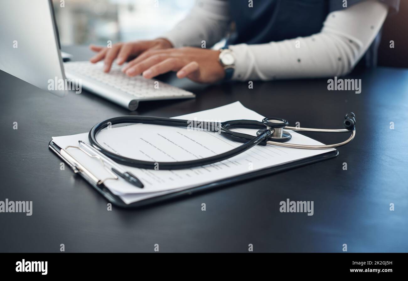 Getting ready for my next patient. Shot of an unrecognizable doctor ...