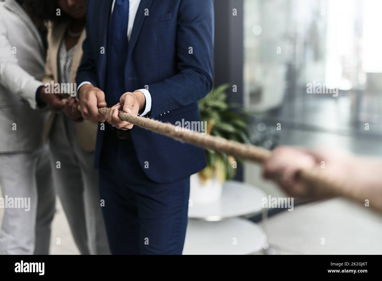 Rope hands pulling together hi-res stock photography and images - Alamy