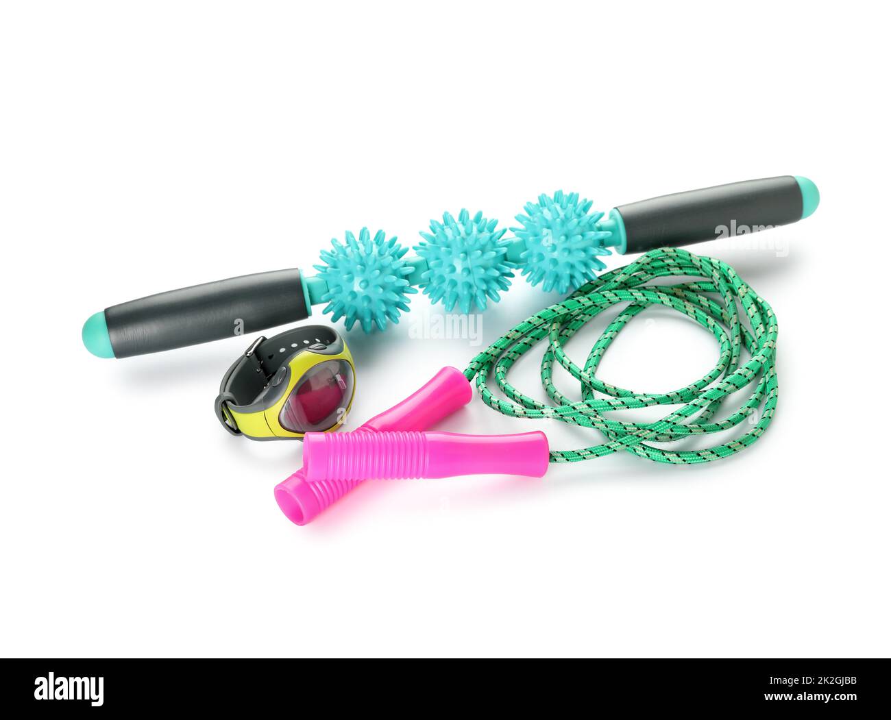 Skipping rope, body roller and watch on white background Stock Photo ...