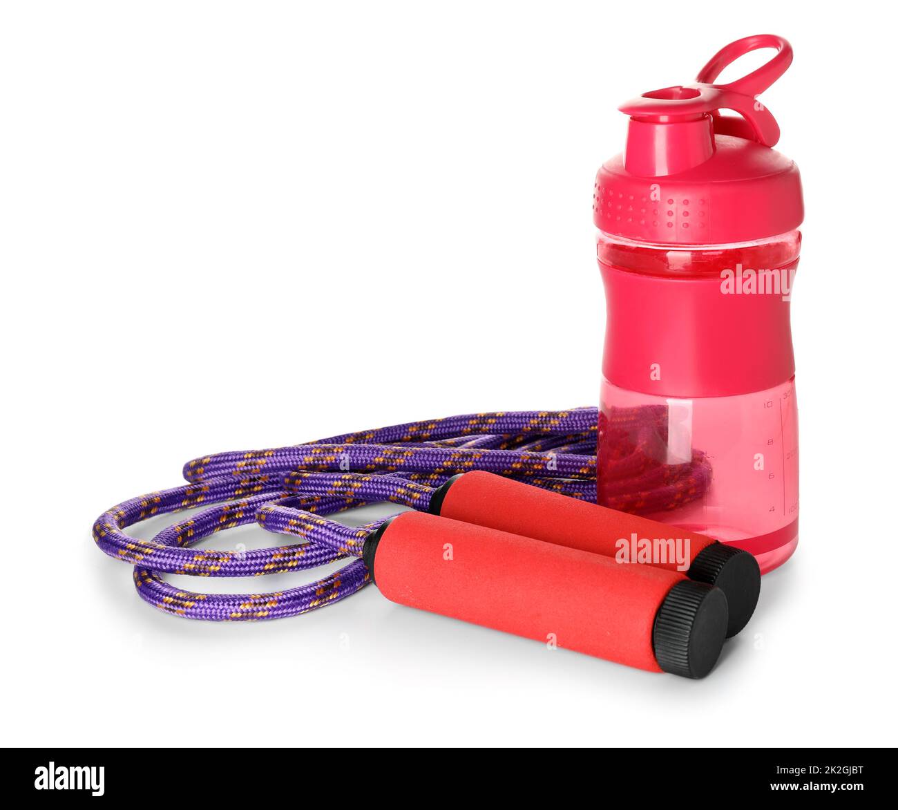 Skipping rope and bottle of water on white background Stock Photo - Alamy
