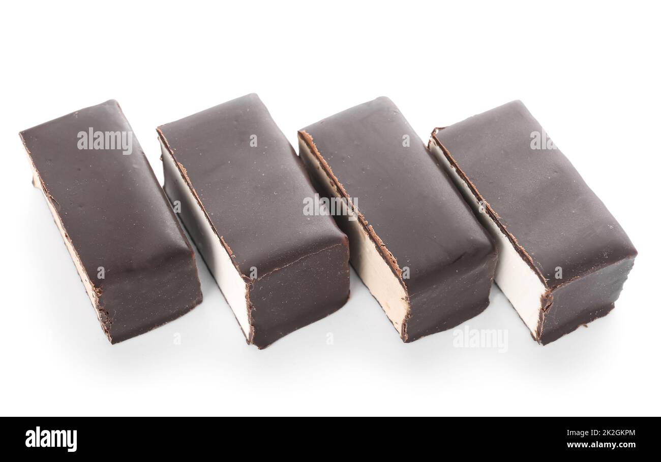 Row of tasty bird's milk candies isolated on white background Stock ...