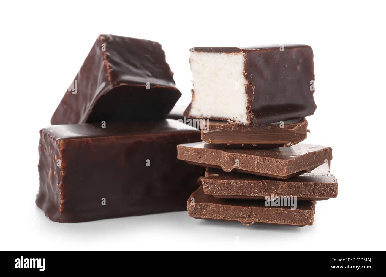 Tasty bird's milk candies and chocolate on white background Stock Photo ...