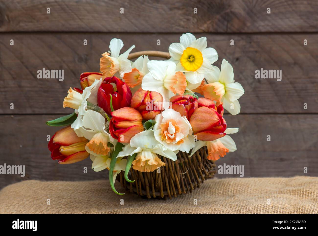 bouquet of spring flowers in a basket Stock Photo - Alamy