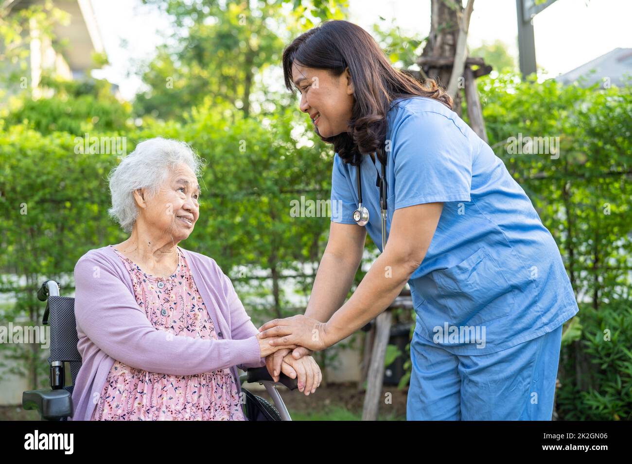Doctor help and care Asian senior or elderly old lady woman patient sitting on wheelchair at ...