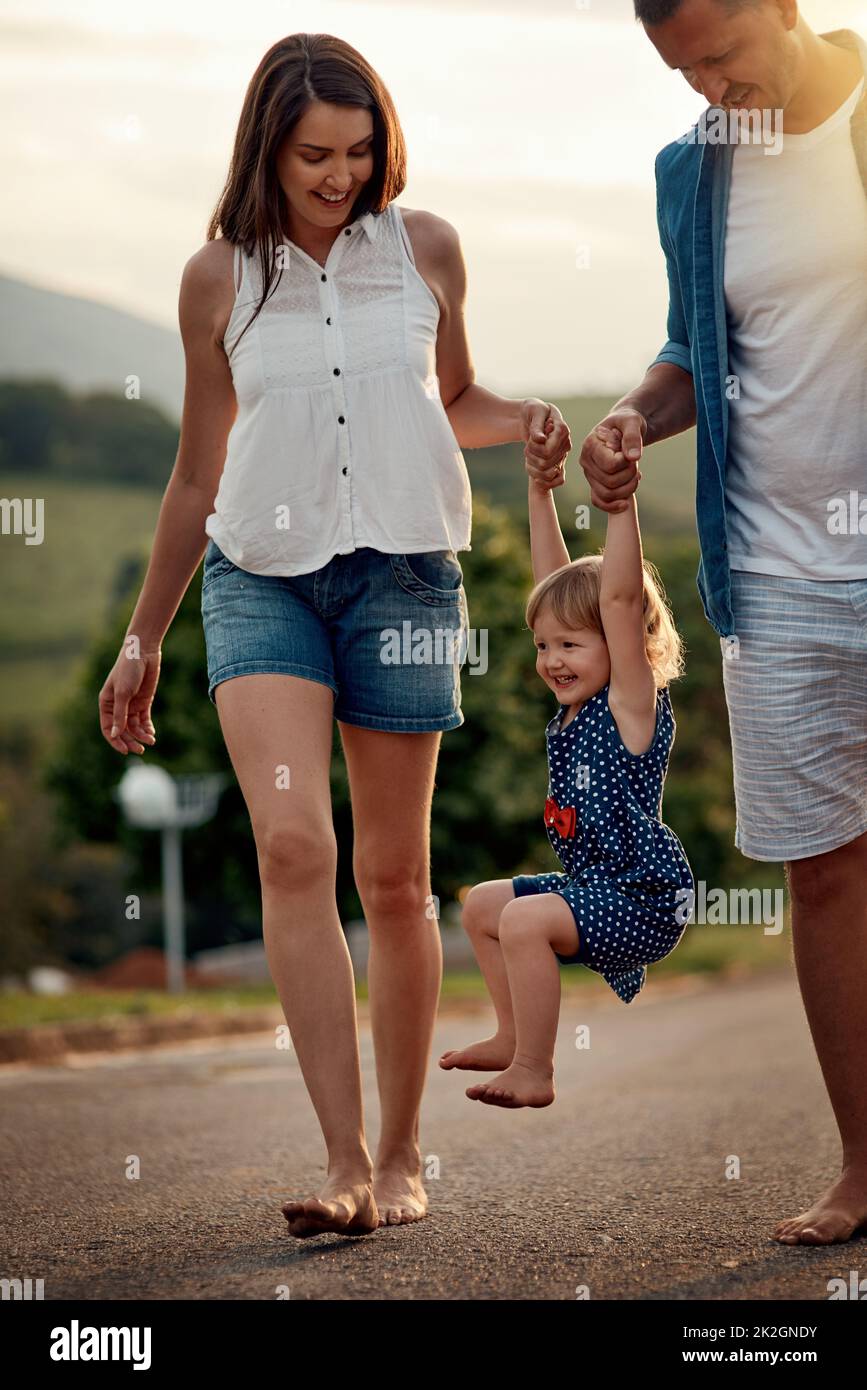Quick fun stroll around the neighbourhood. Shot of a young family ...