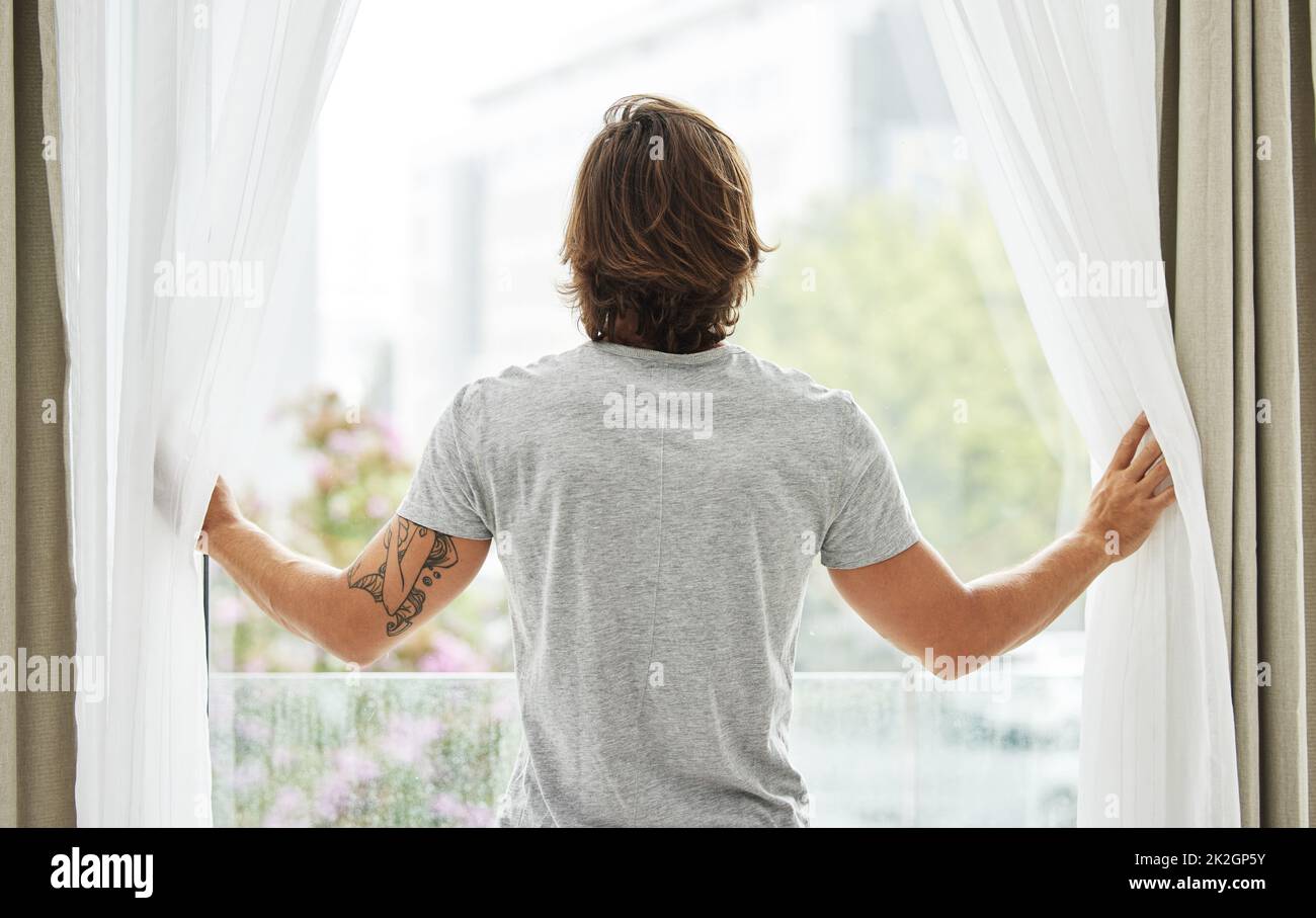 Man opening curtains in the morning hi-res stock photography and images ...