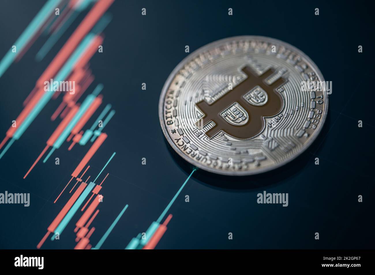 Silver Bitcoin with candle stick graph chart and digital background ...