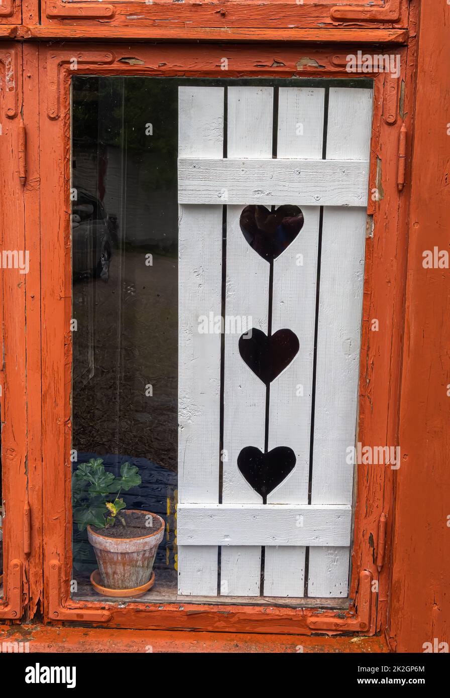 Traditional white window shutter with heart form Stock Photo - Alamy