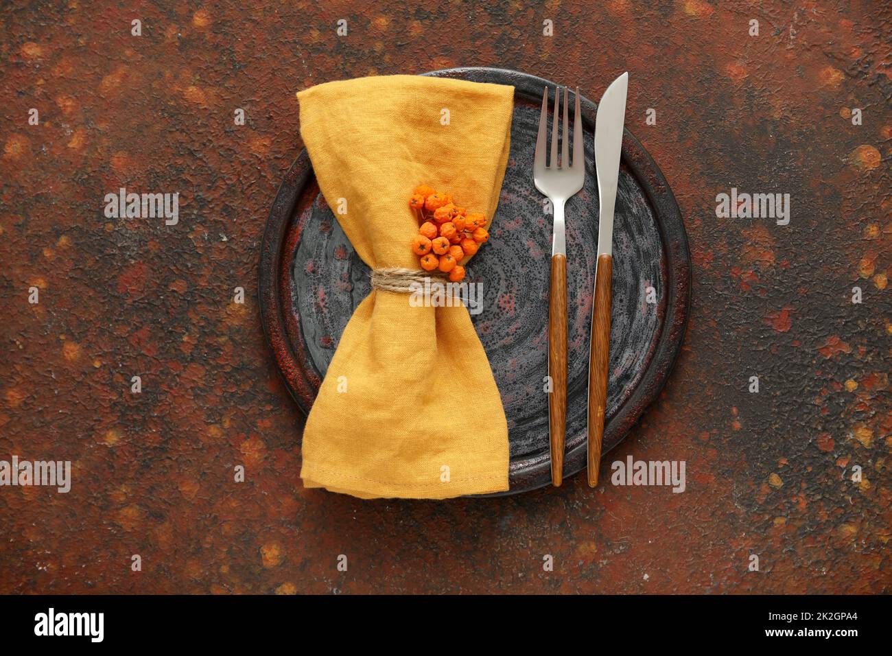 Autumn table setting with rowan on grunge background Stock Photo - Alamy