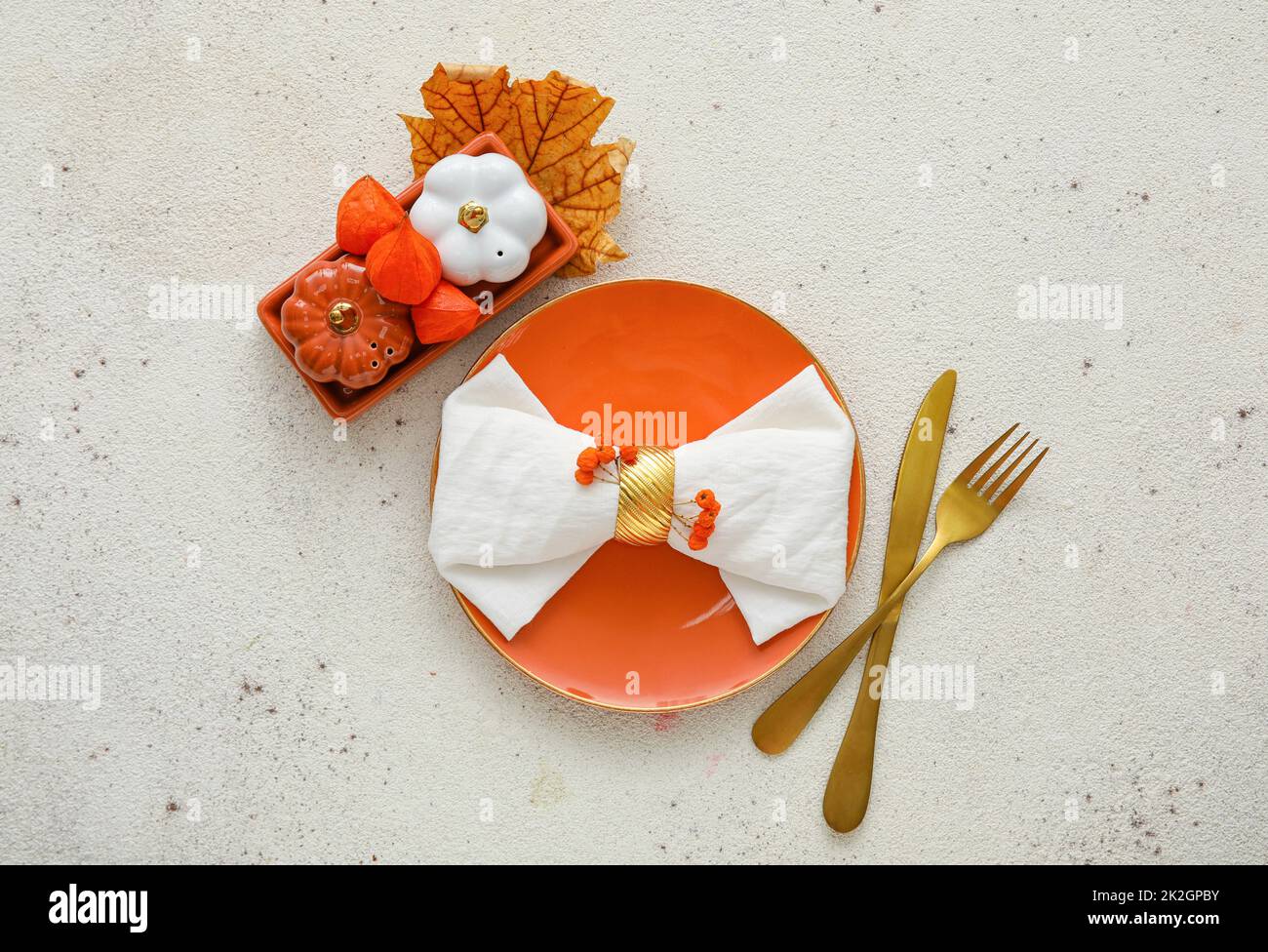 Autumn table setting with rowan and fallen leaf on white background Stock Photo - Alamy