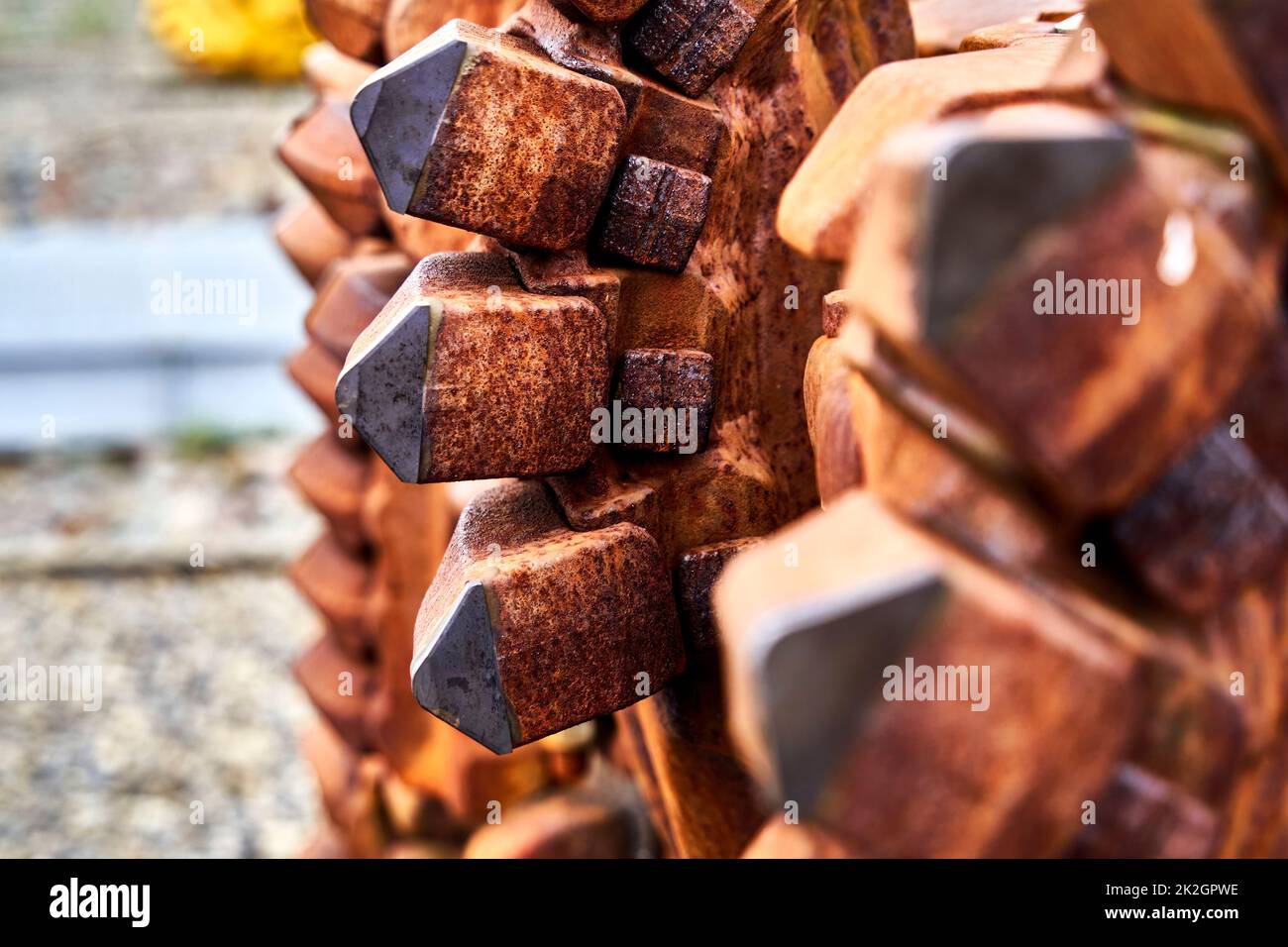 Rusty teeth of a decommissioned shearer used to break up coal in ...