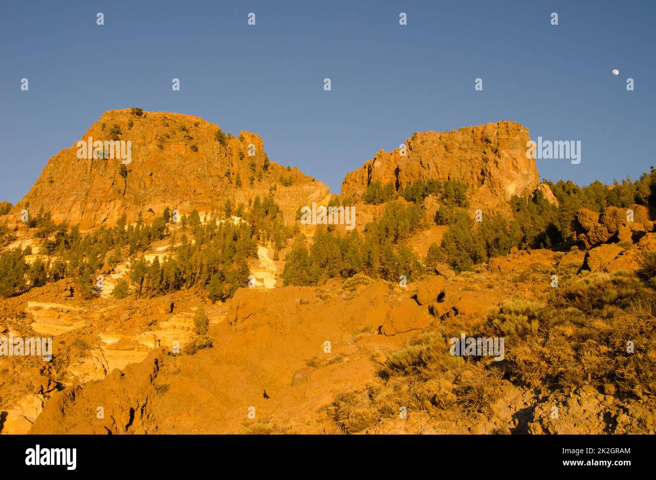 Rocky cliffs and moon Stock Photo - Alamy