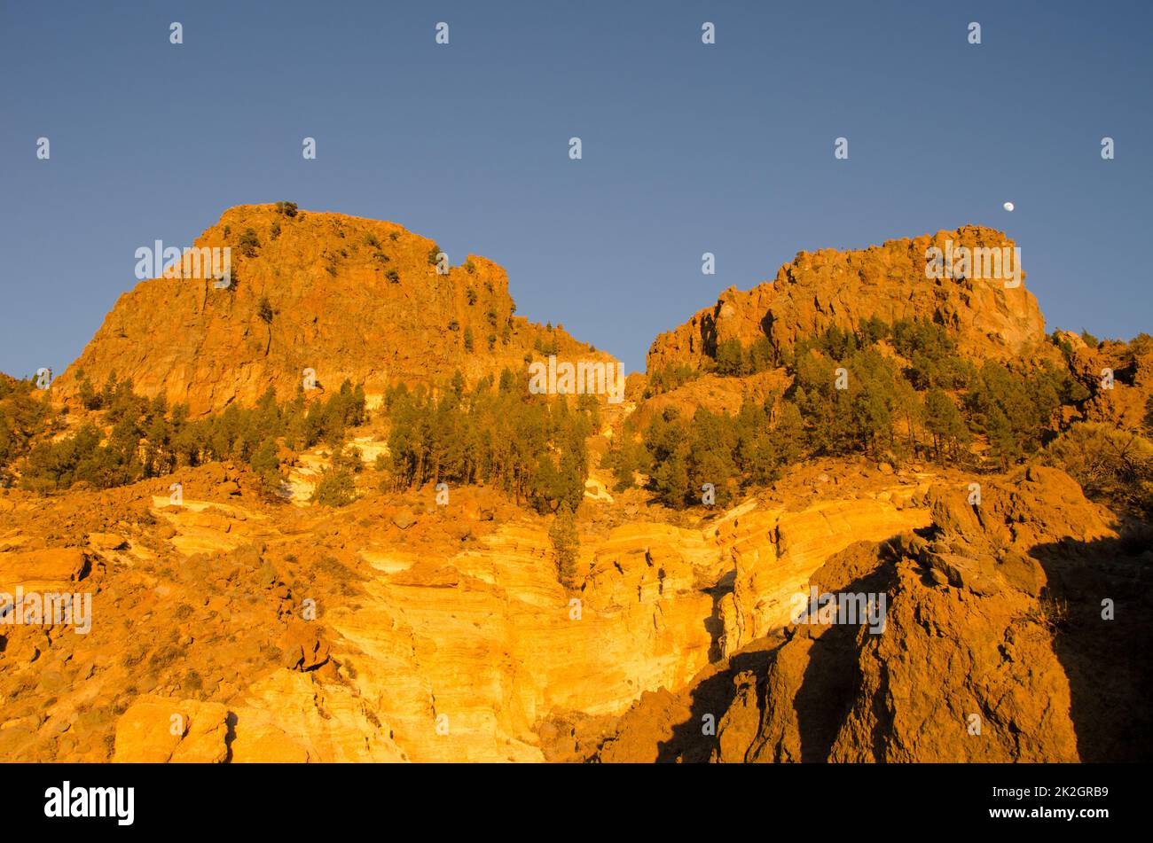 Rocky cliffs and moon Stock Photo - Alamy