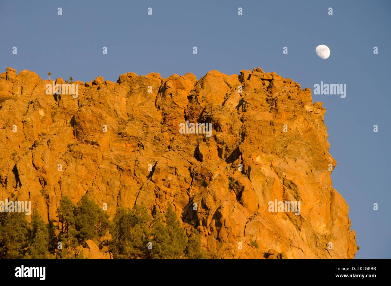 Rocky cliff and moon Stock Photo - Alamy
