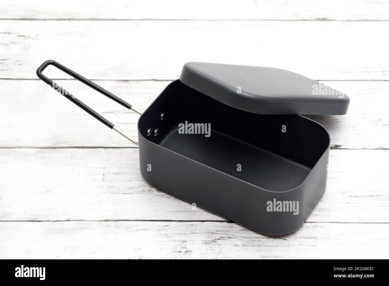 New aluminum mestin on a white painted wooden table Stock Photo - Alamy