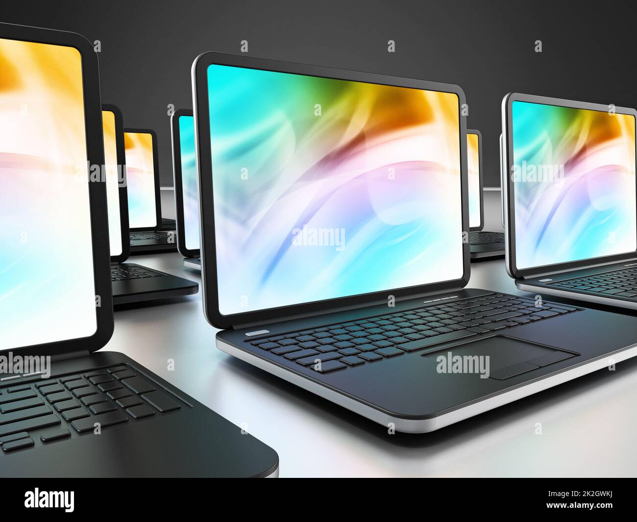 Laptop computers in a row Stock Photo - Alamy